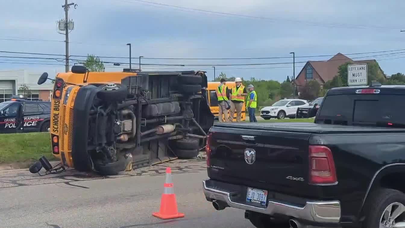 School bus rolls over on East Beltline – WOODTV.com